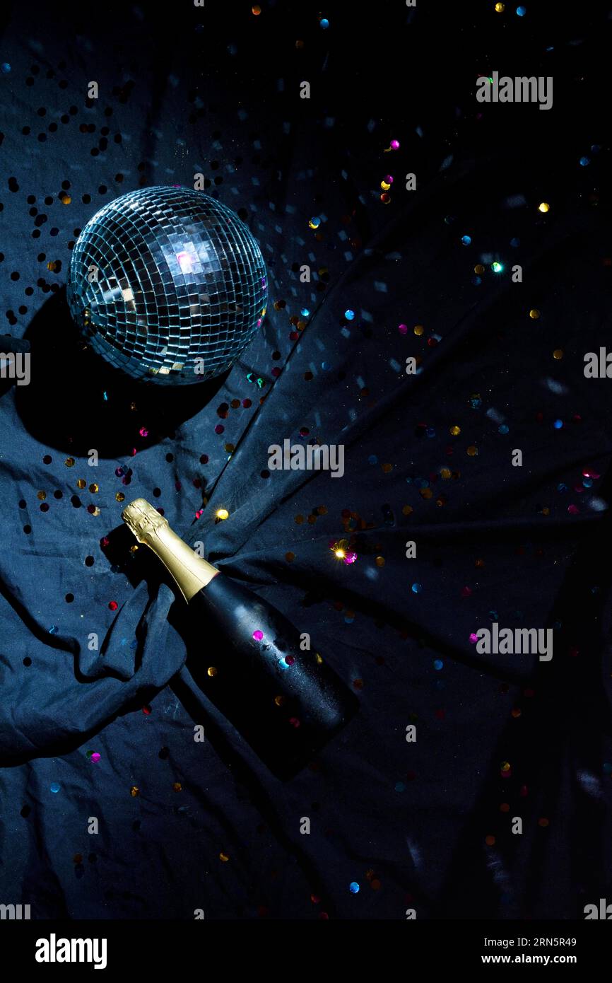 Disco ball with champagne bottle floor Stock Photo - Alamy