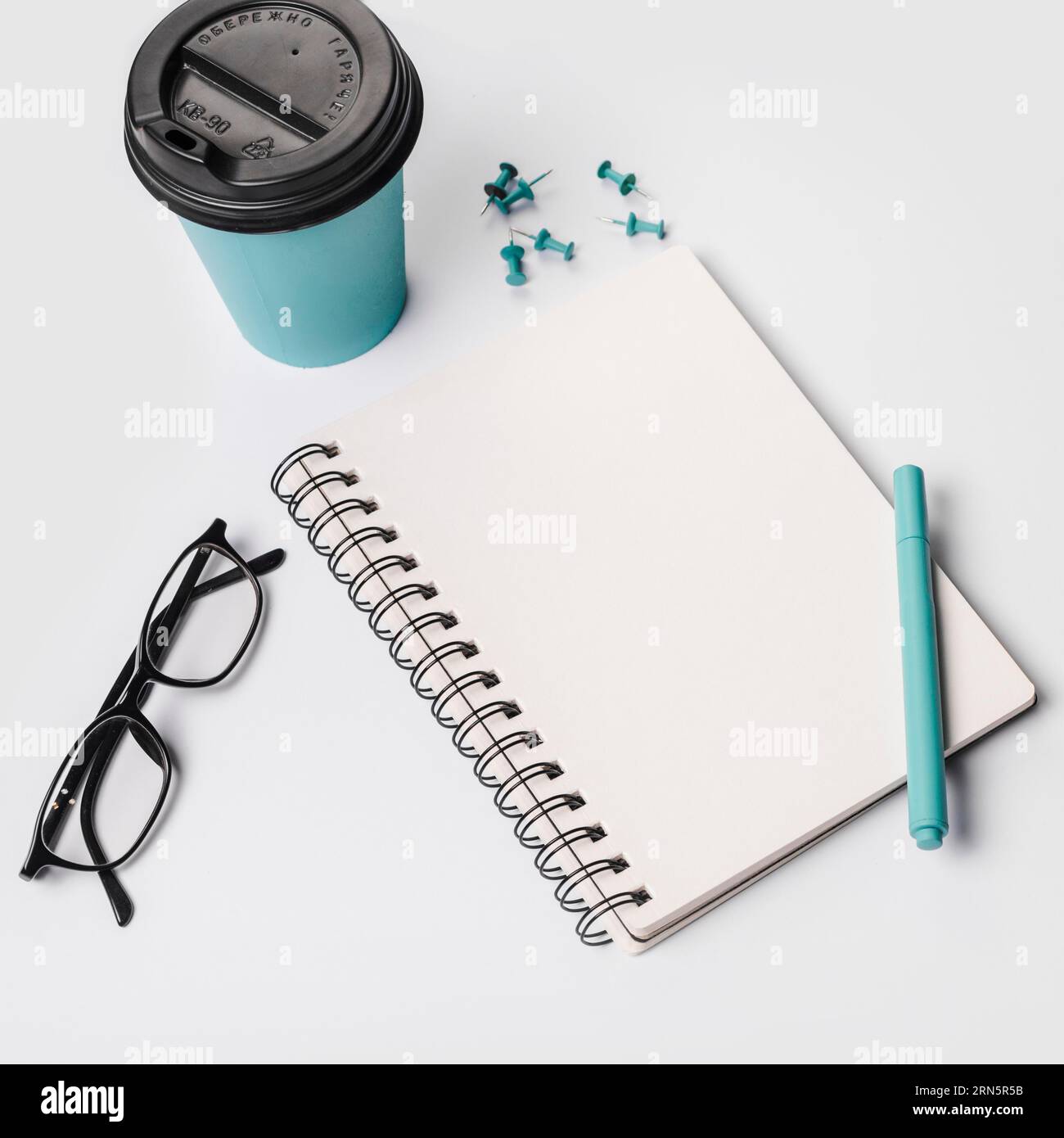 Disposable coffee cup pen eyeglasses spiral notepad thumbtack pins ...