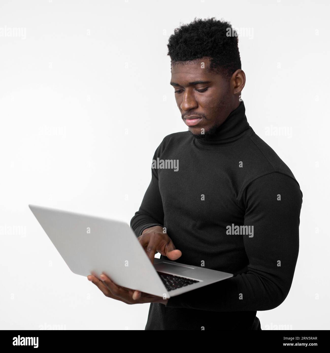 Man illuminated by laptop sofa hi-res stock photography and images - Alamy