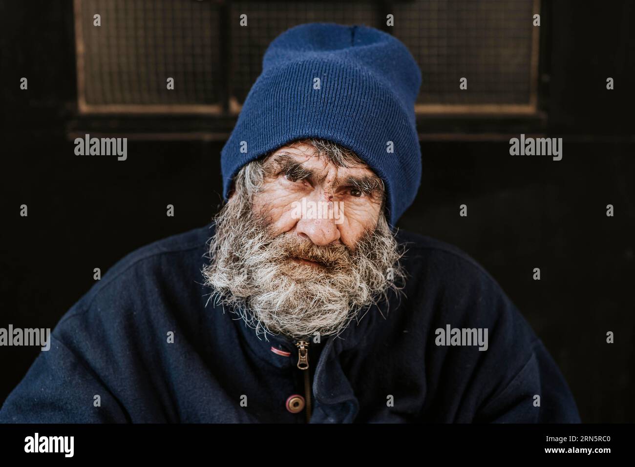 Front view homeless man with beard Stock Photo - Alamy