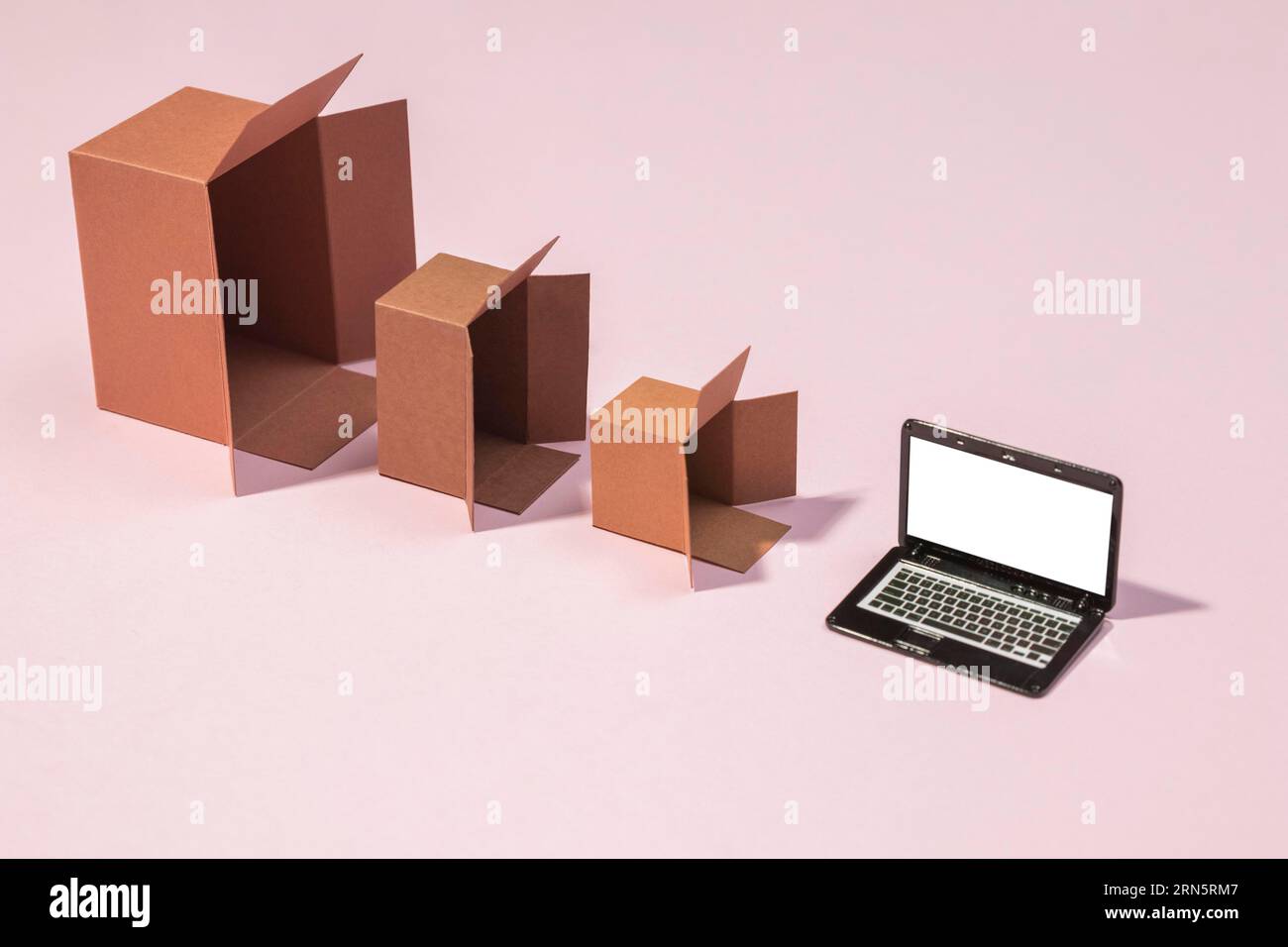 High angle boxes laptop arrangement Stock Photo - Alamy