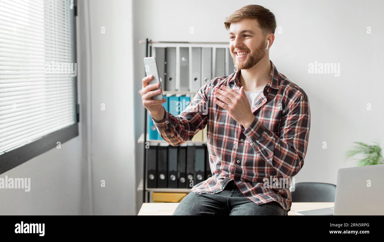 Man using mobile video call Stock Photo - Alamy