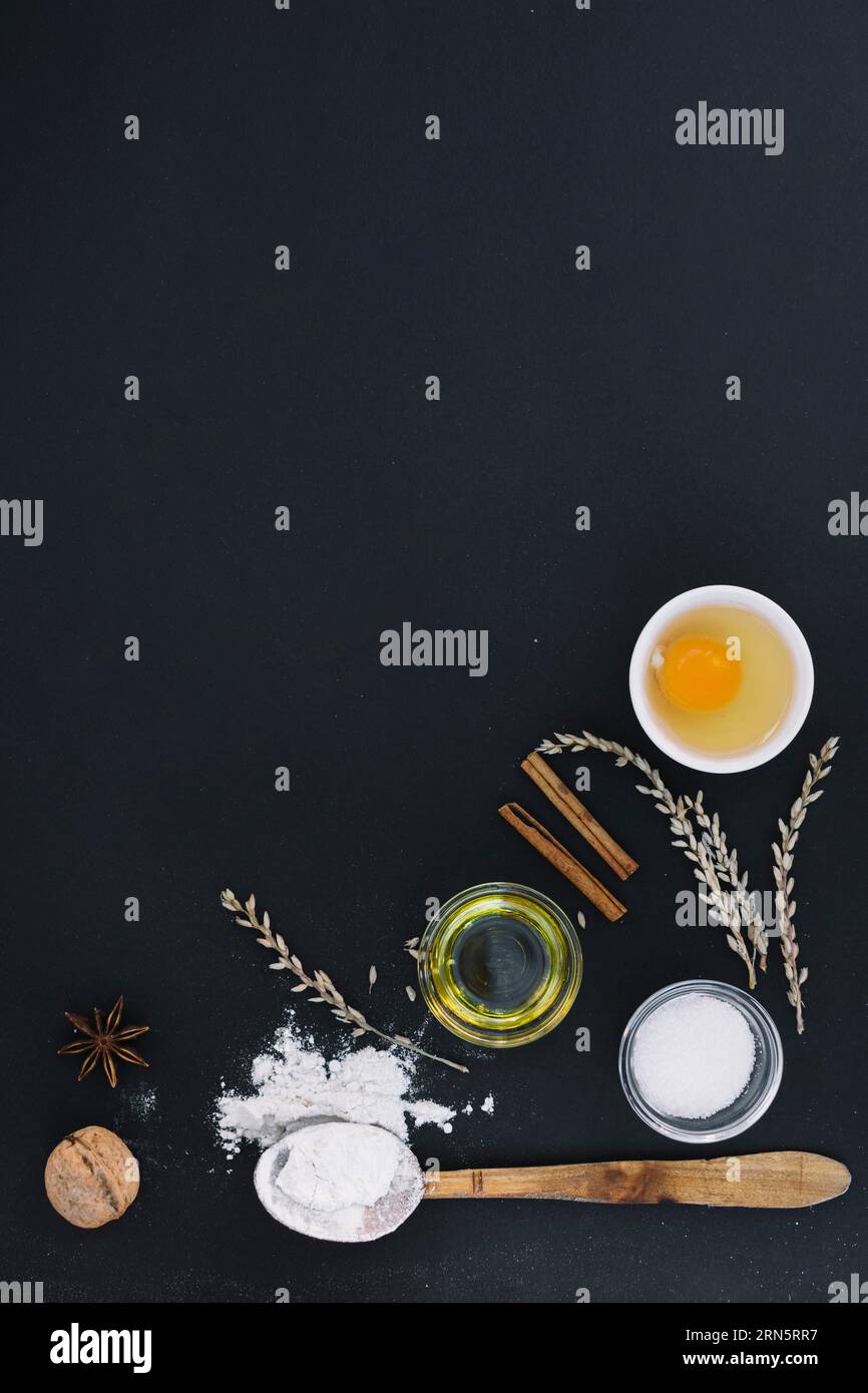 High angle view various baking ingredients black background Stock Photo ...