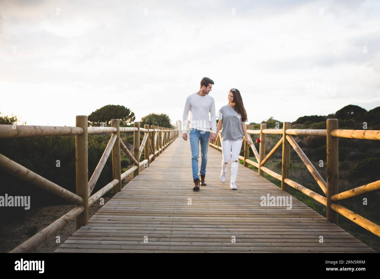 Loving couple walking bridge hi-res stock photography and images - Alamy