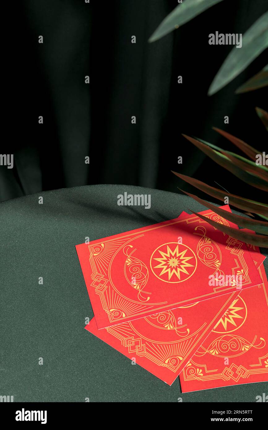 High angle red tarot cards table Stock Photo - Alamy