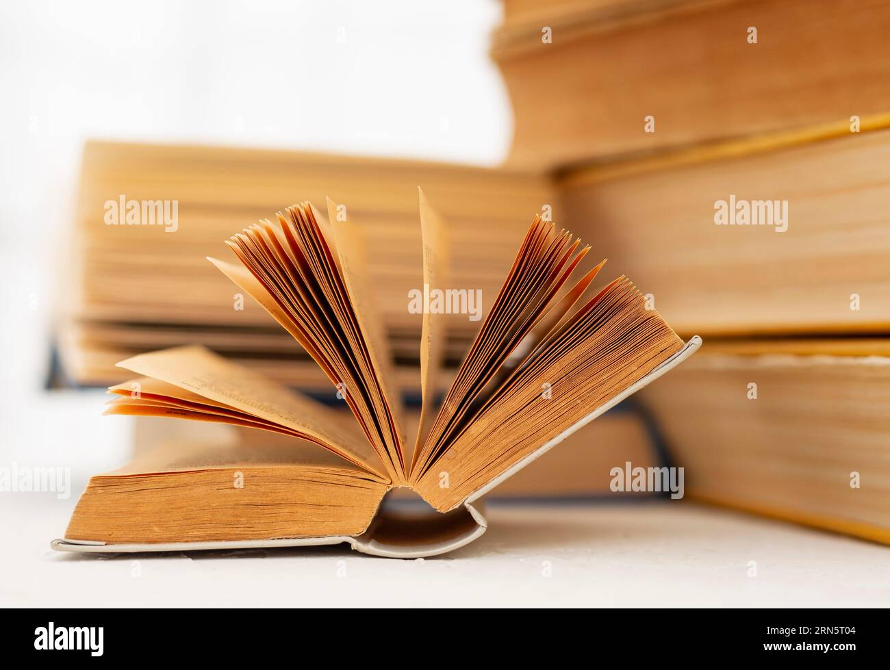 Open book table Stock Photo - Alamy