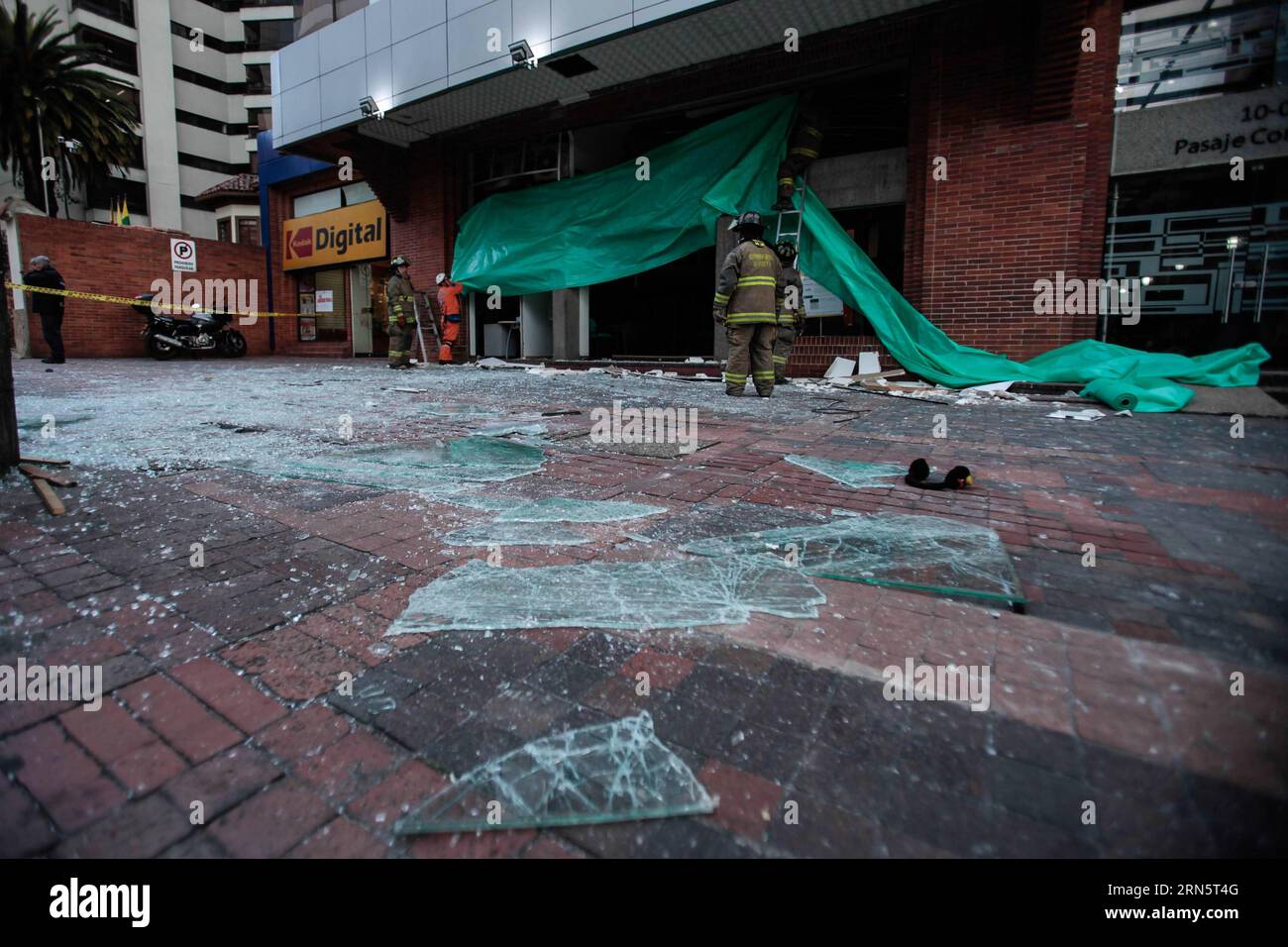 The ground is covered with broken glass at the explosion site in Bogota ...
