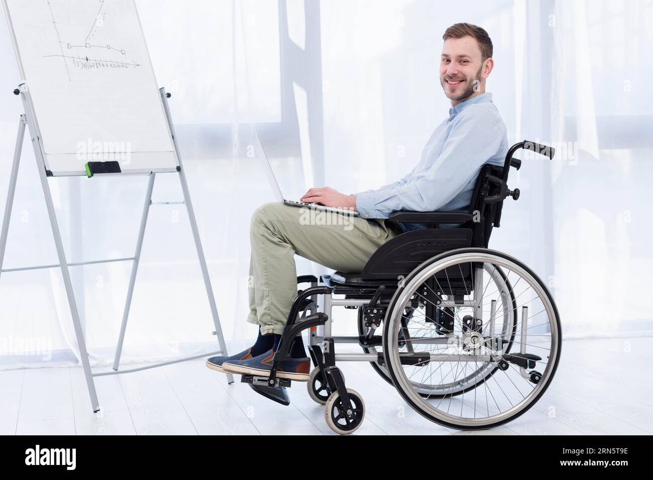 Side view man wheelchair Stock Photo - Alamy