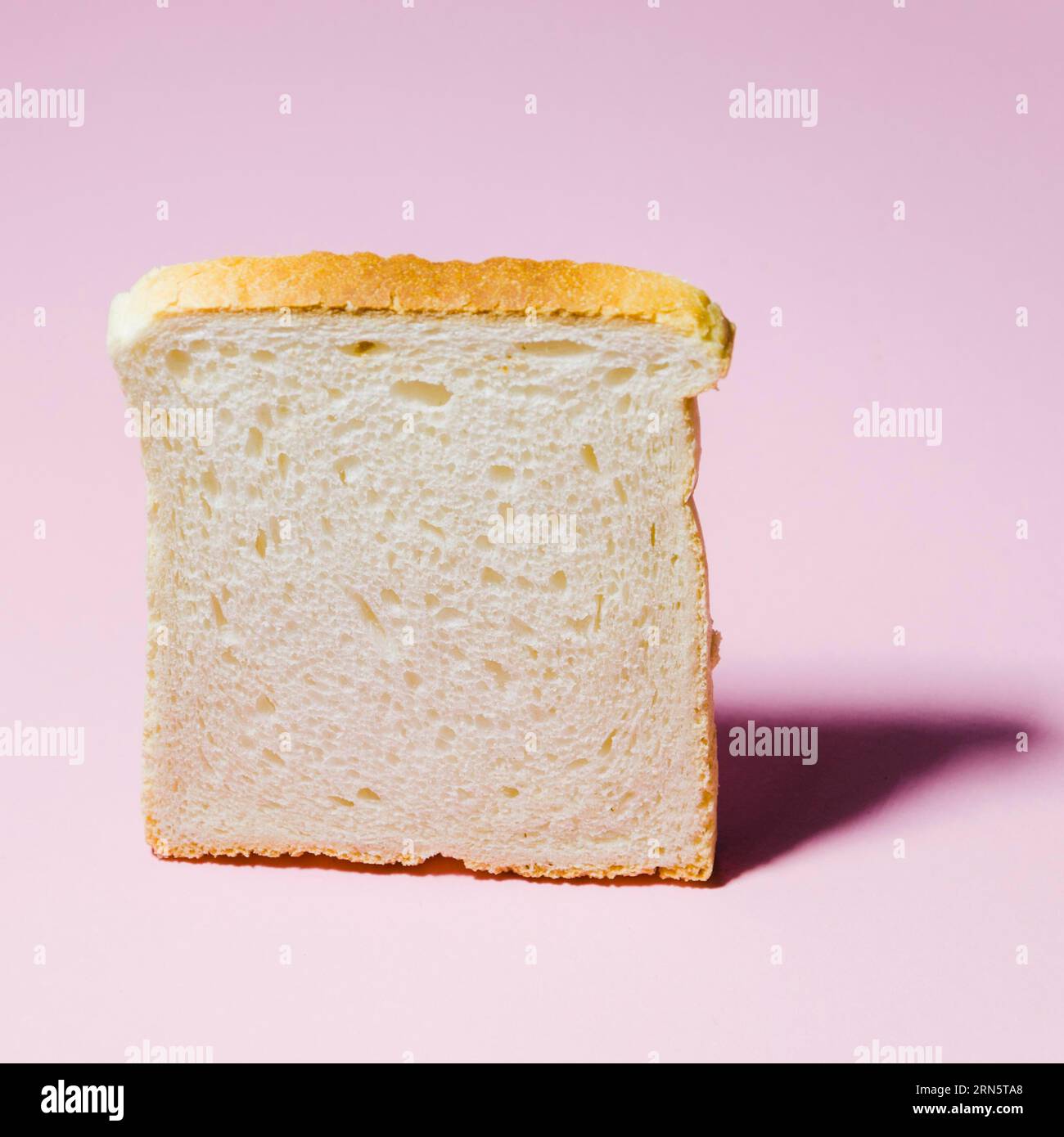 Slice bread with color background Stock Photo - Alamy