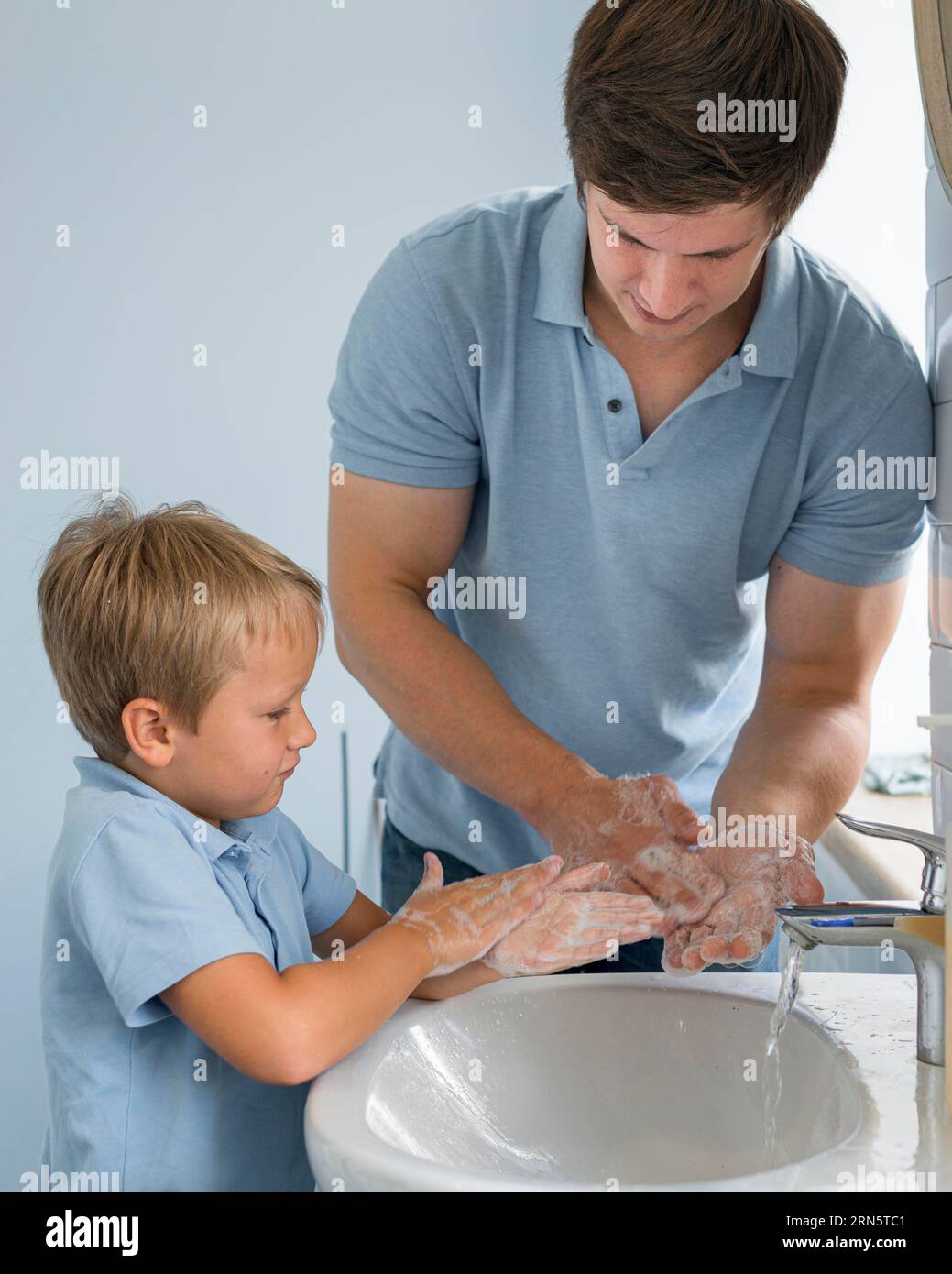 Father son washing hands hi-res stock photography and images - Alamy