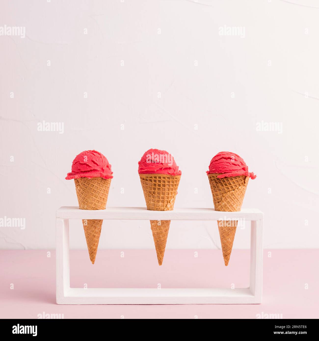 Red ice cream cones holder Stock Photo - Alamy