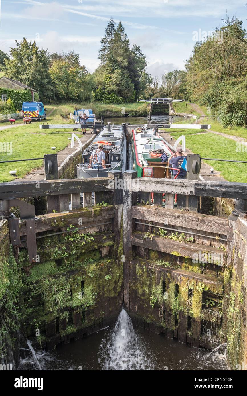 Two narrowboats negotiating one of the locks,called Carpenters lock ...