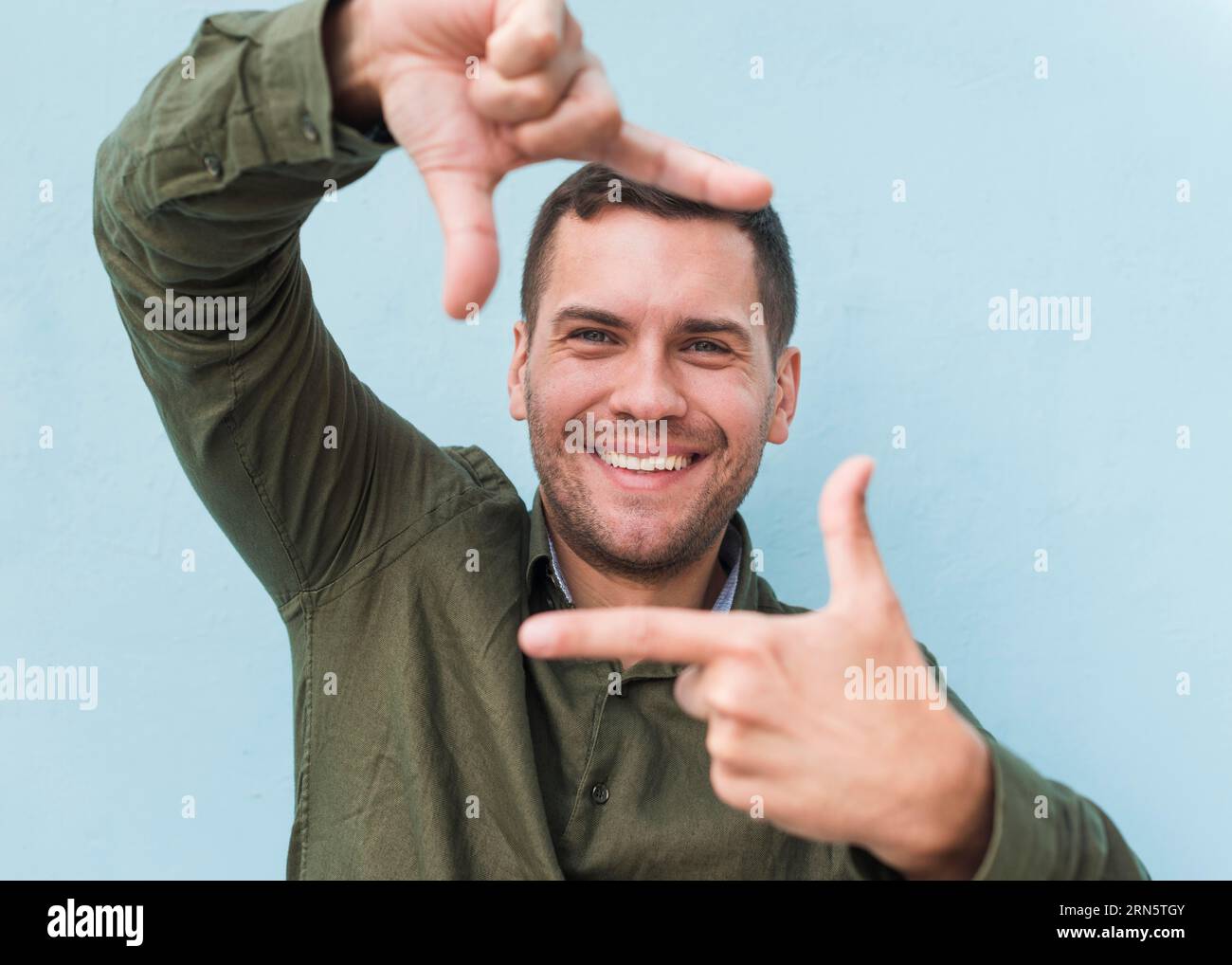 Young handsome man cooks hi-res stock photography and images - Alamy