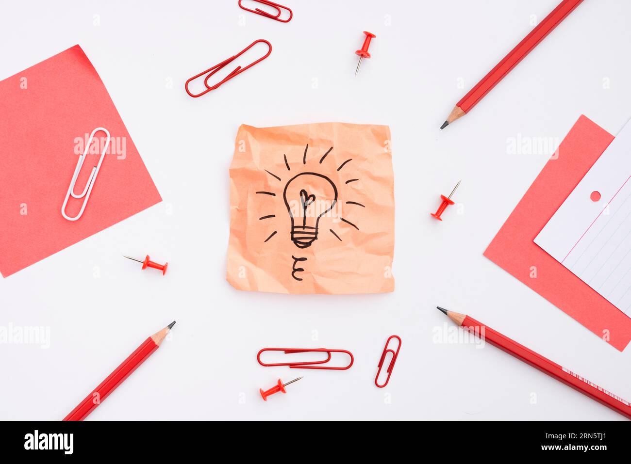 Sticky note with drawn light bulb office supplies white background ...