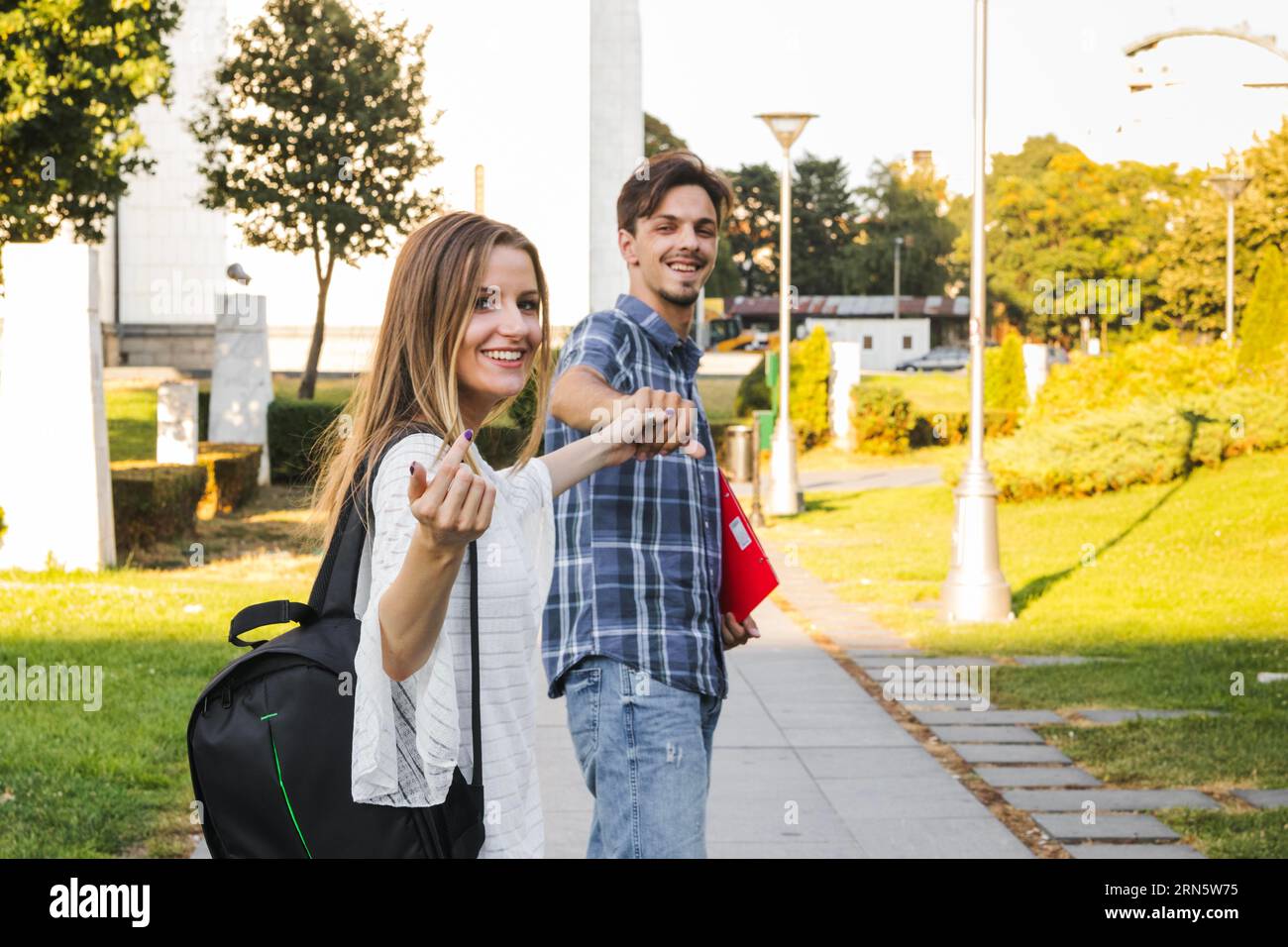 Young students asking follow Stock Photo - Alamy