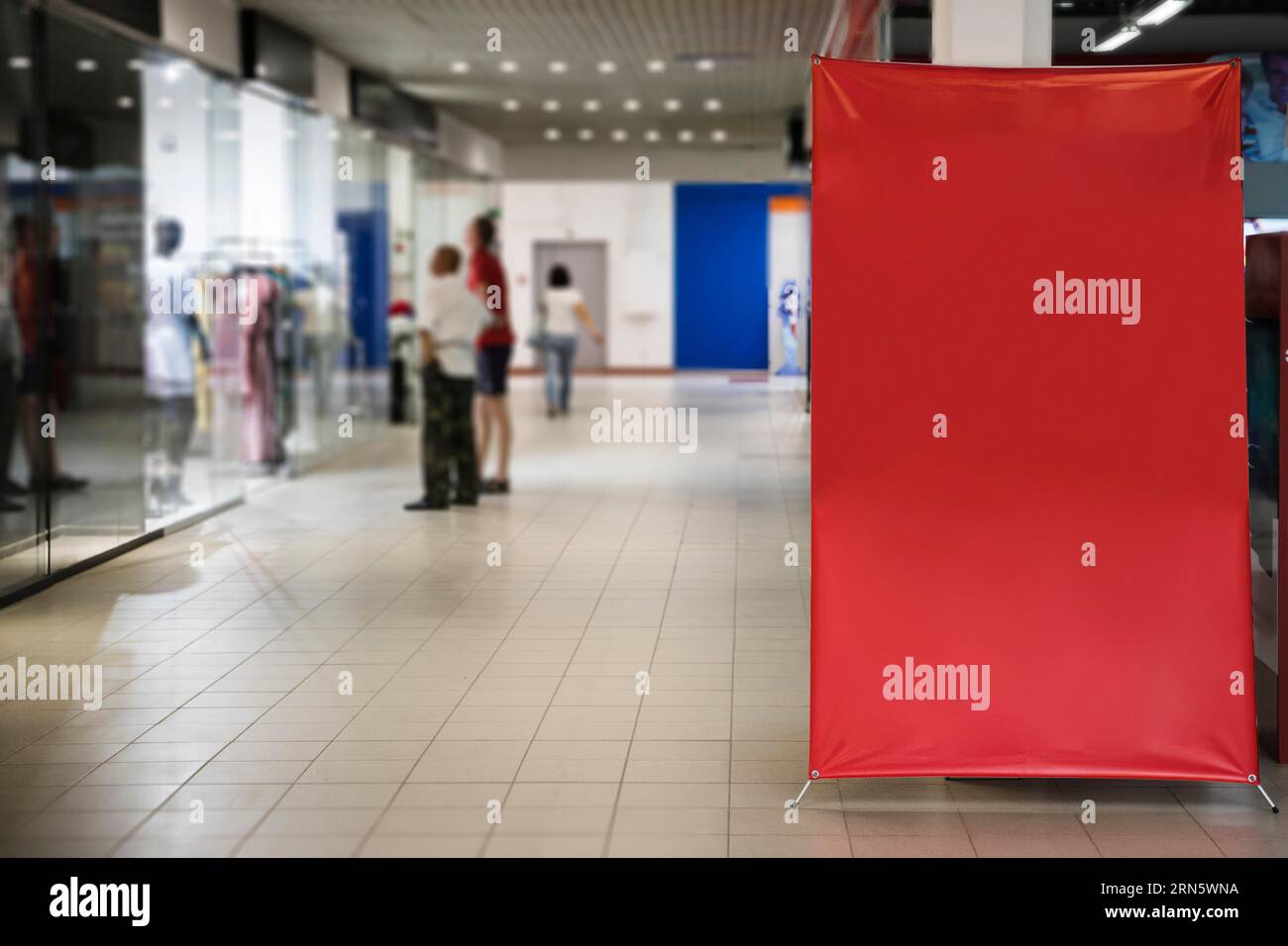 Blank red sign inside shopping mall Stock Photo - Alamy