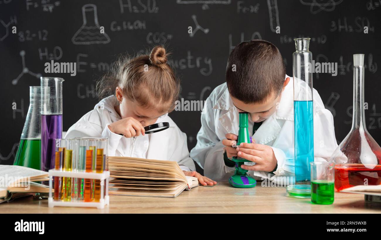 Children doing experiments laboratory Stock Photo - Alamy