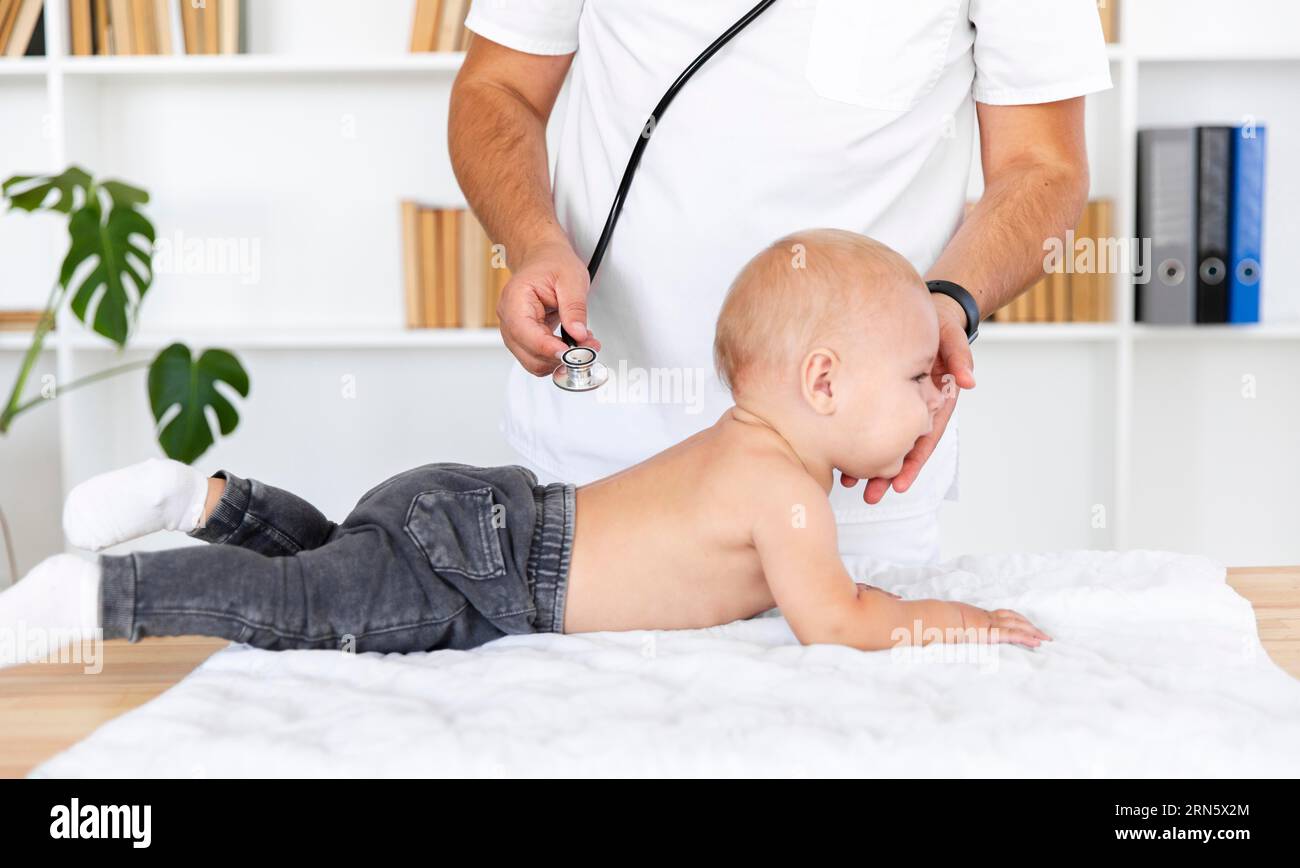Doctor hands listening baby patient with stethoscope Stock Photo - Alamy
