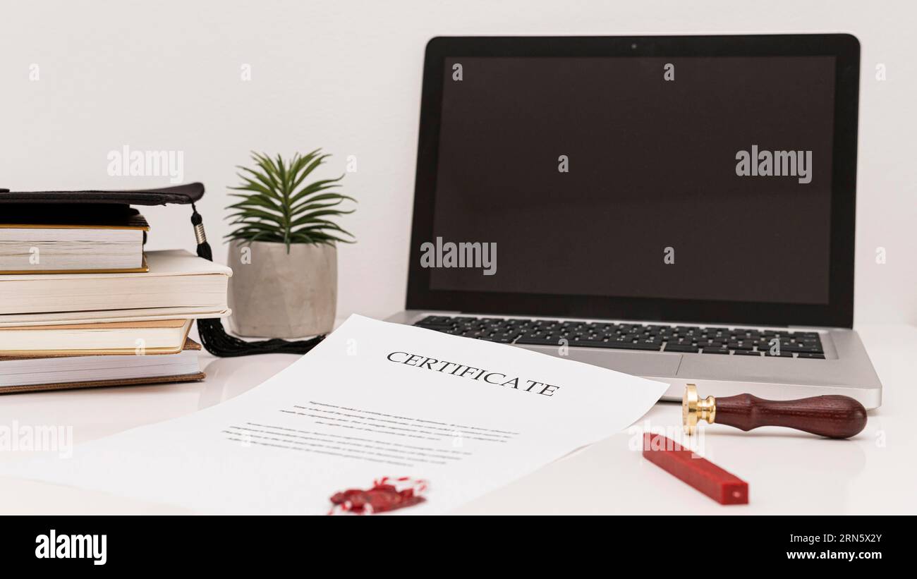 Digital devices graduation diploma certificate Stock Photo - Alamy