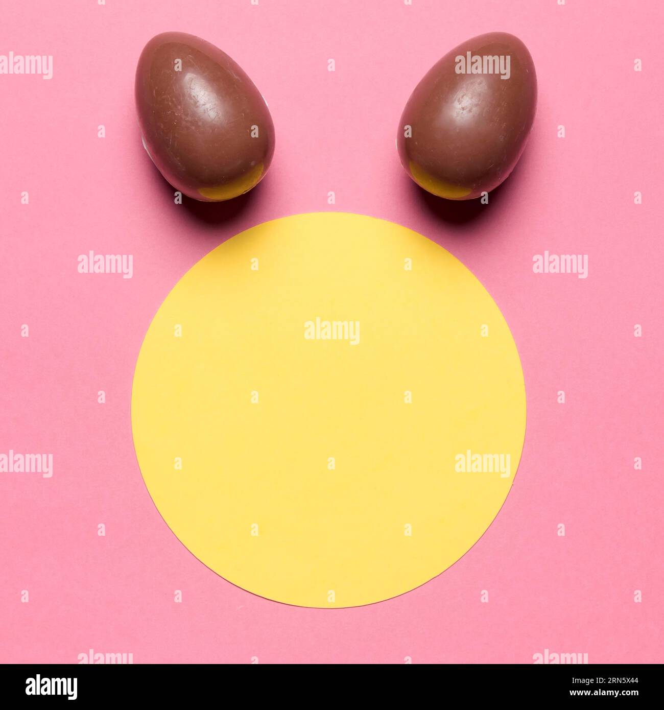 Easter eggs like bunny ear s round paper blank frame against pink ...