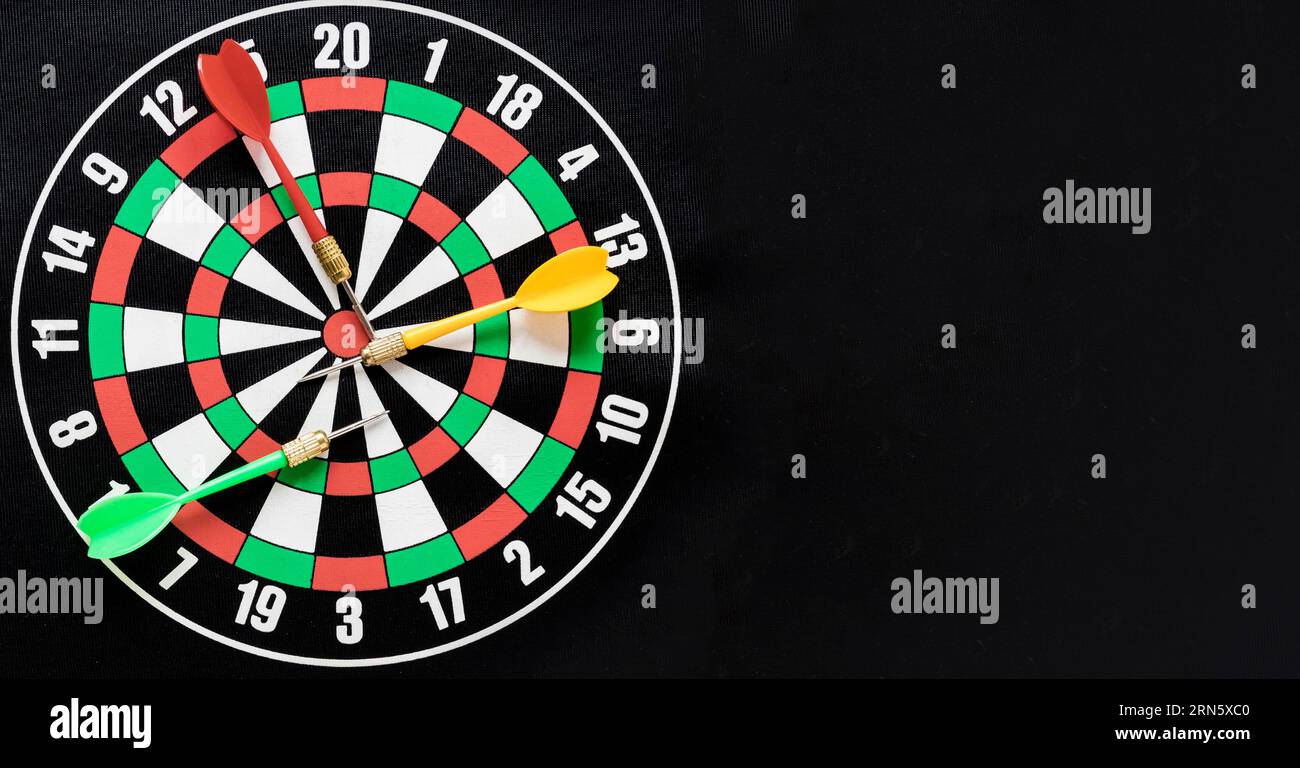 Flat lay darts table black background with copy space Stock Photo - Alamy