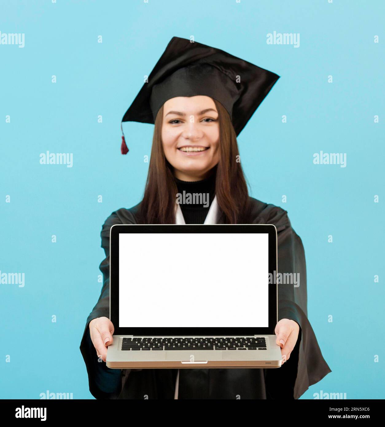 Front view girl holding laptop Stock Photo - Alamy
