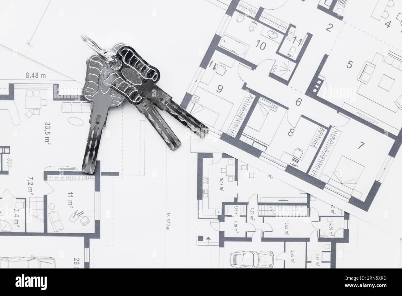 House keys architectural blueprints plans Stock Photo - Alamy