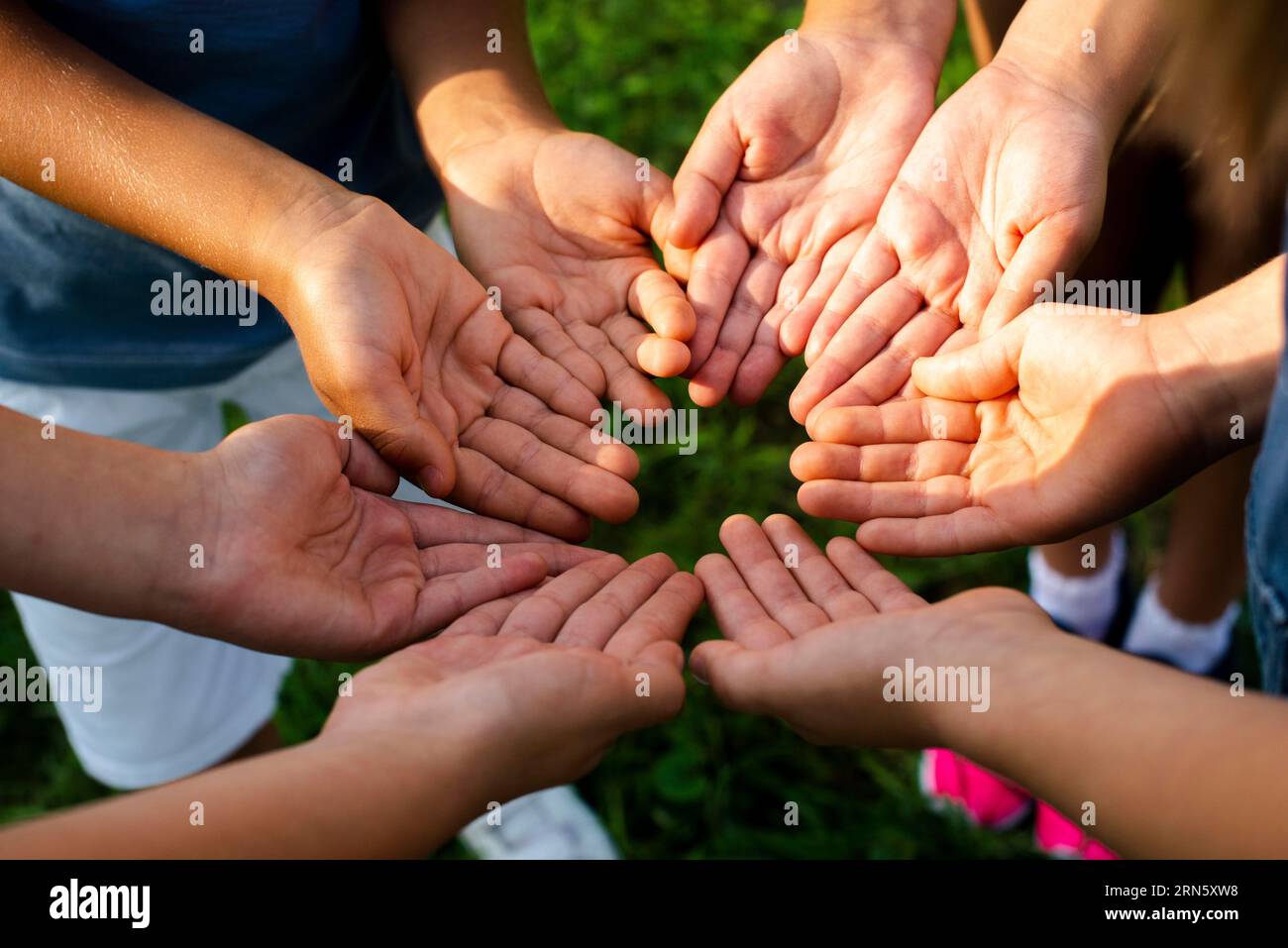 High angle friends showing hands camera Stock Photo - Alamy