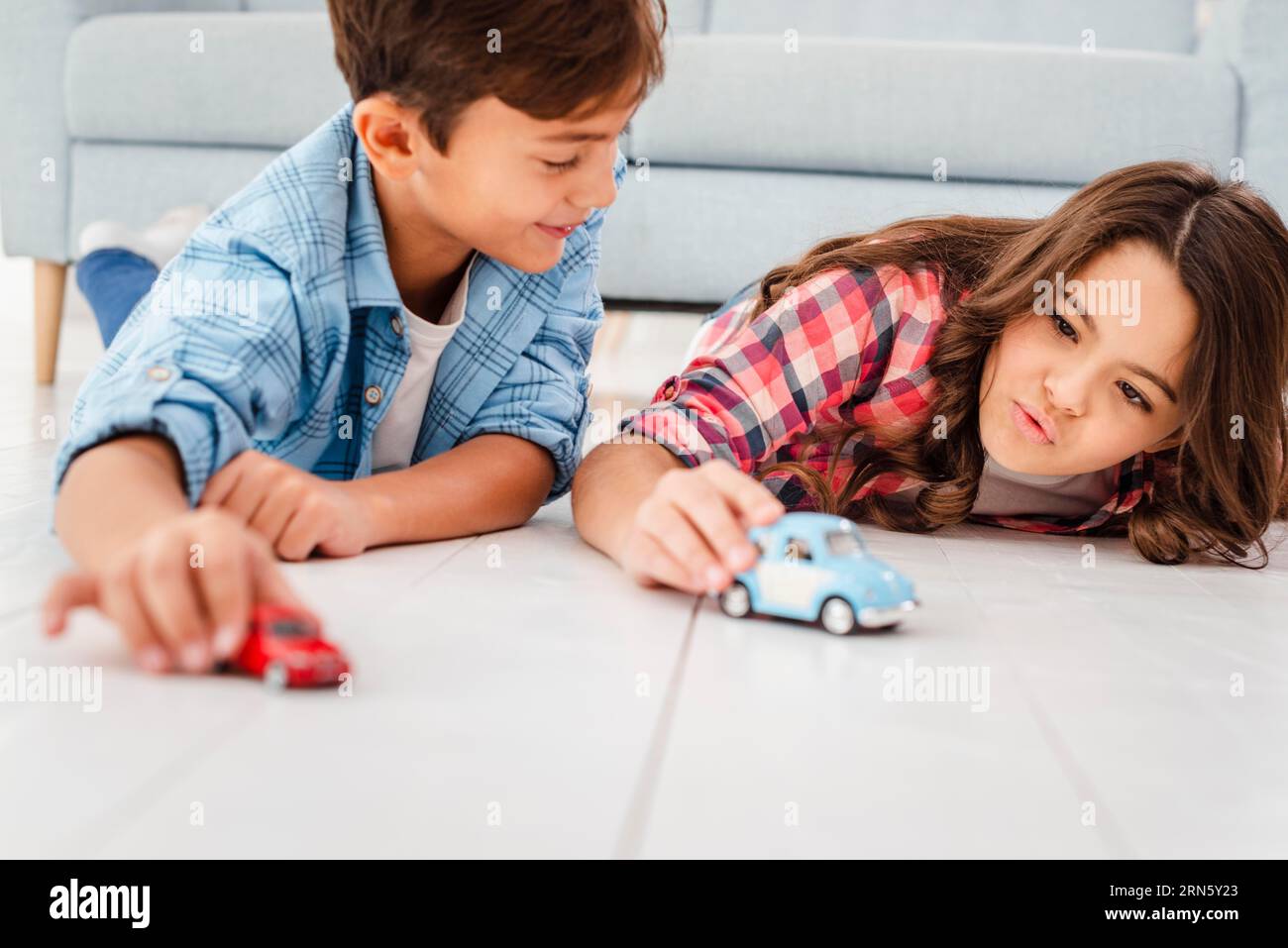 Low angle car race siblings Stock Photo - Alamy