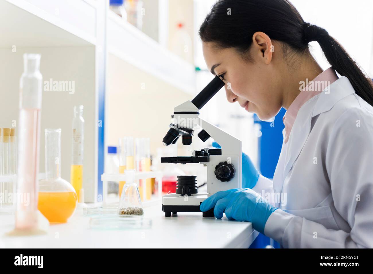 Side view female chemist hi-res stock photography and images - Alamy