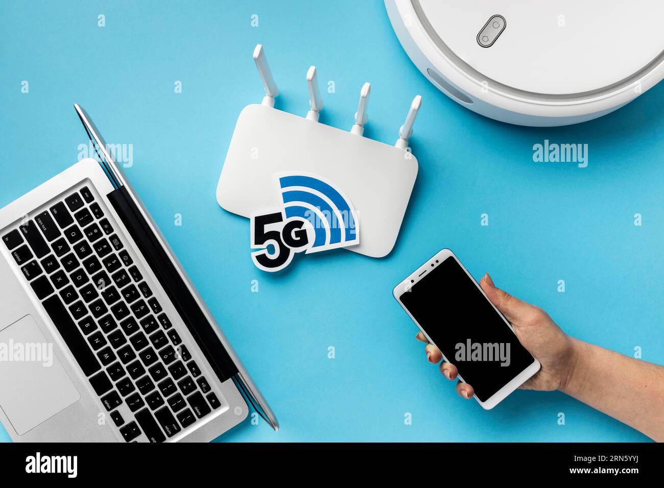 Top view wi fi router with laptop vacuum cleaner Stock Photo - Alamy