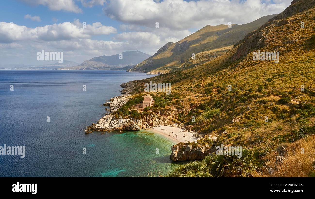 Cloudy weather, coastline, green coastal mountains, small bay, pebble ...