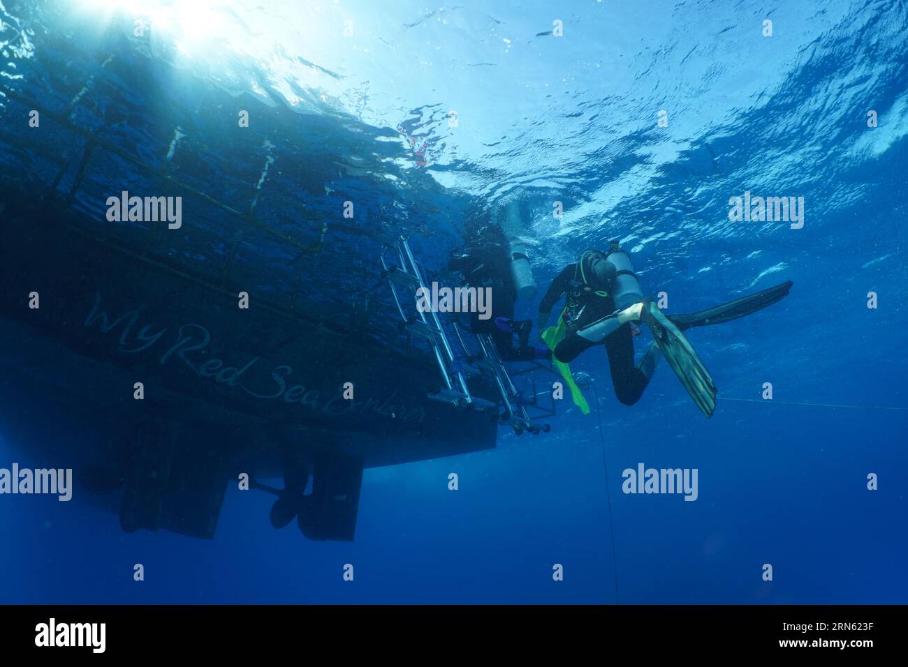 Safari boat, dive boat, livaboard Red Sea Explorer from below. 2 divers ...