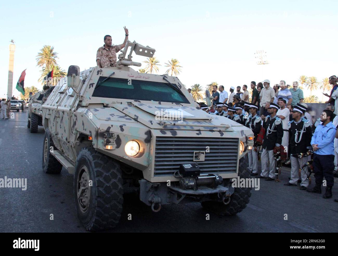 (150708) -- TRIPOLI, July 8, 2015 -- Soldiers on armed vehicles attend ...