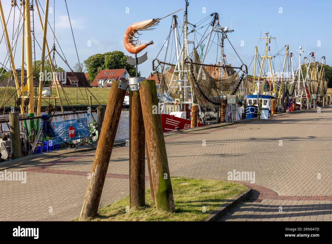 Shrimp sculptures on a pedestal of three tree trunks and in the ...