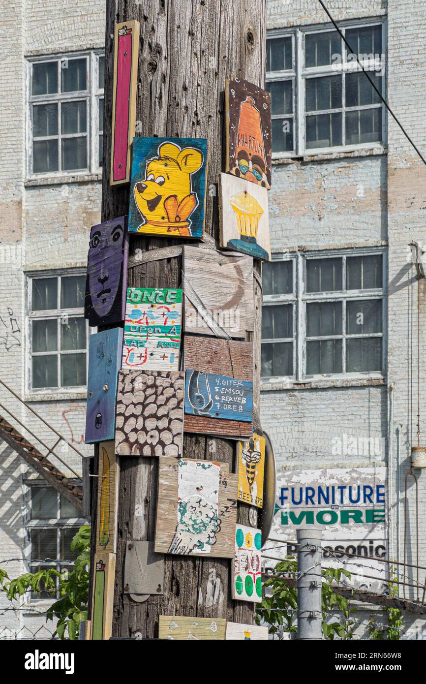 Art on a power pole, in front of the Graffiti Gallery, Higgins Ave ...