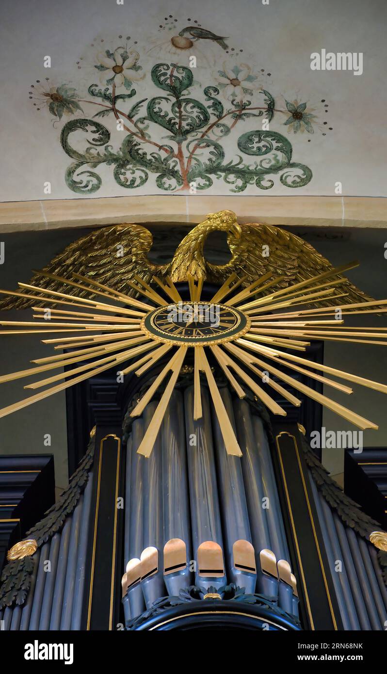 Organ pipes, clock with an image of a golden bird, and 16-century ...
