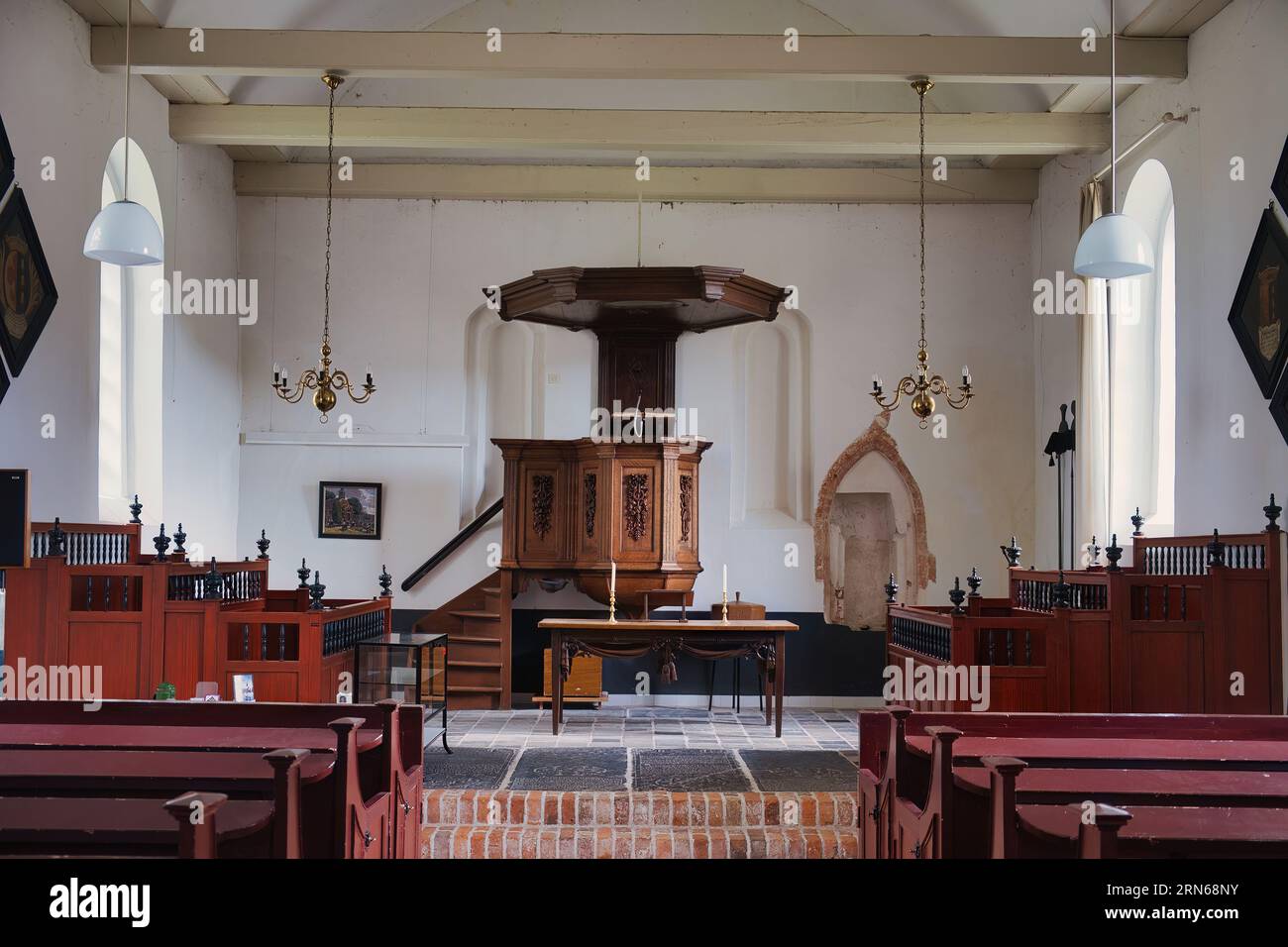 Altar, pulpit and church pews in an old protestant village church in ...