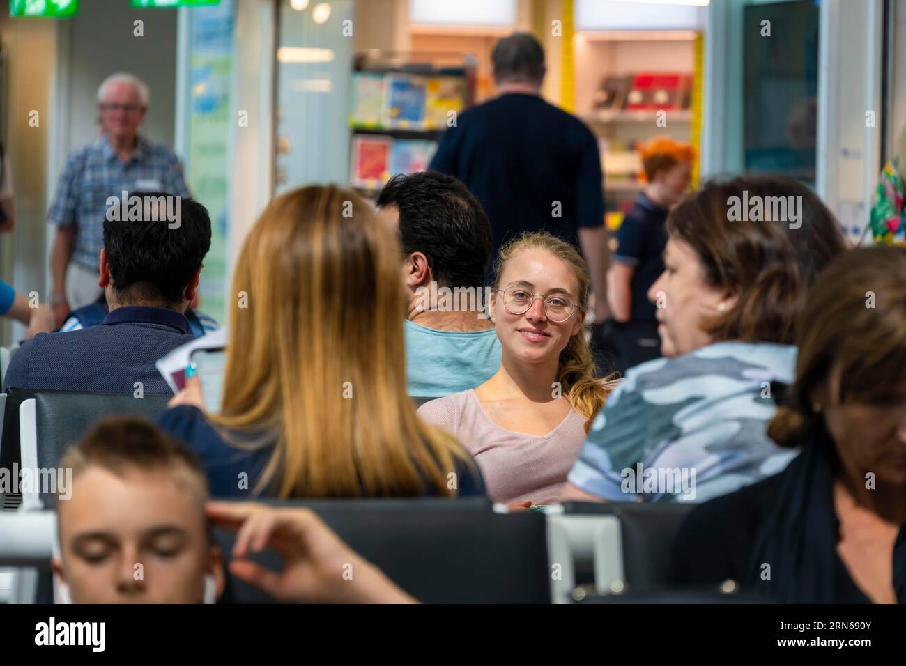 Waiting hall, Young woman waiting for her departure, Check-in, Munich ...