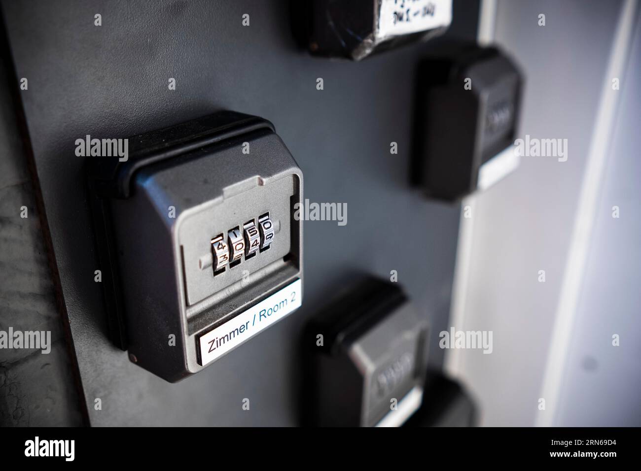Combination locks for deposited keys for access to rooms in a hotel ...