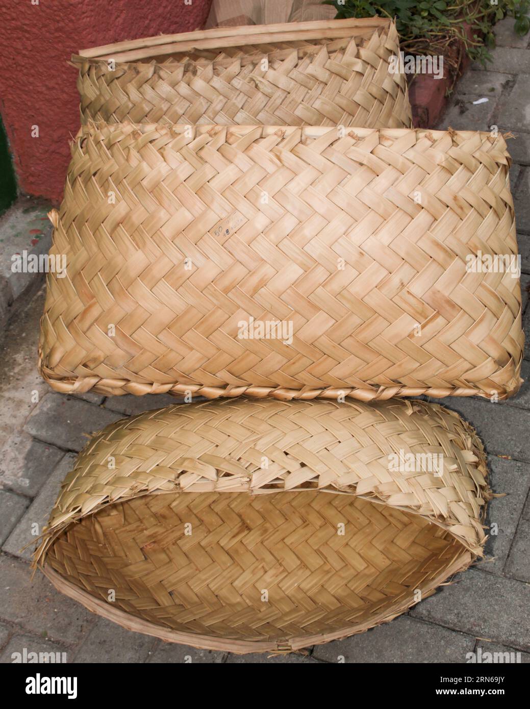 Baskets made of vegetable fibers locked in the indigenous way, called ...