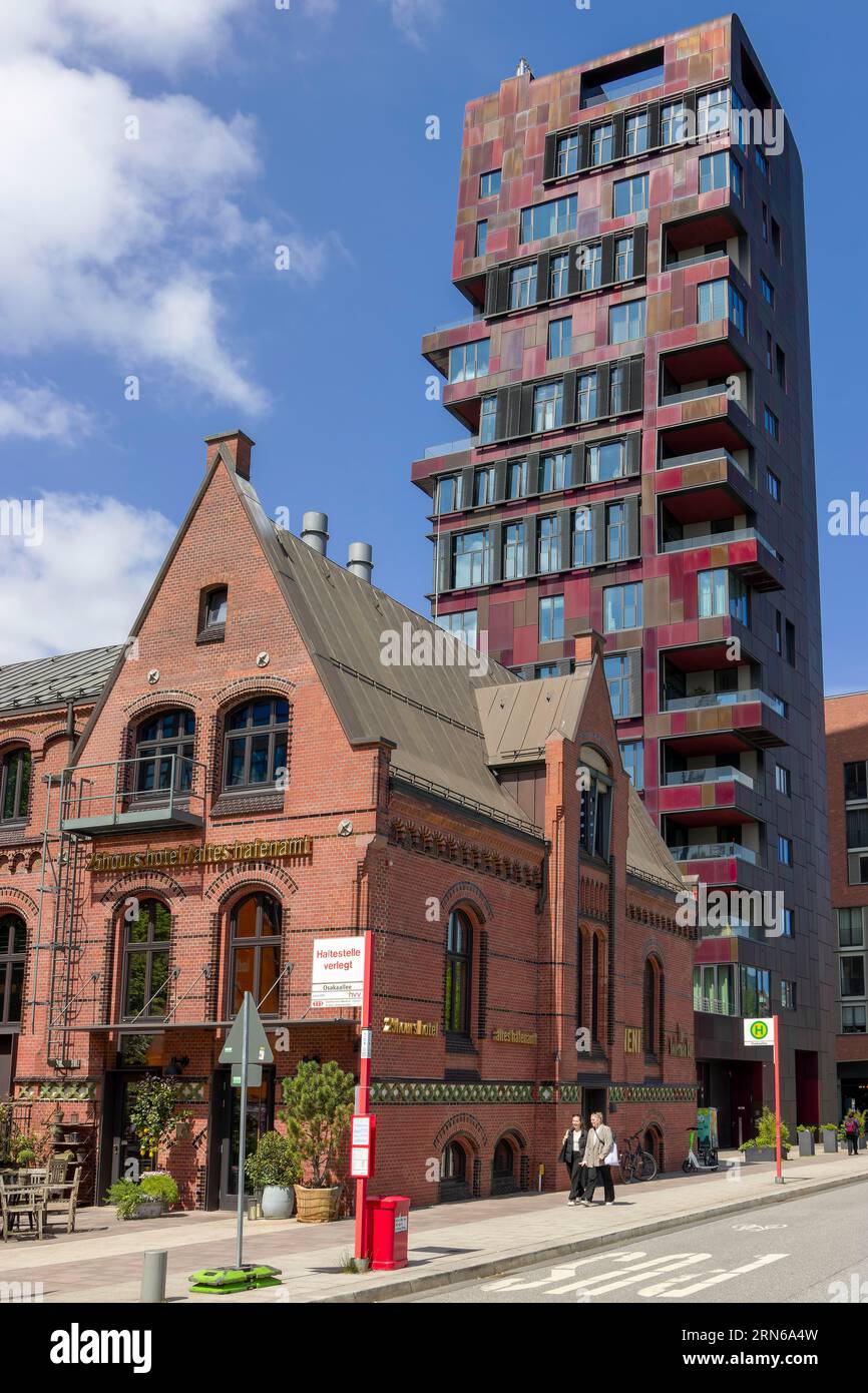 Small historic brick building and modern cinnamon tower, Hamburg ...