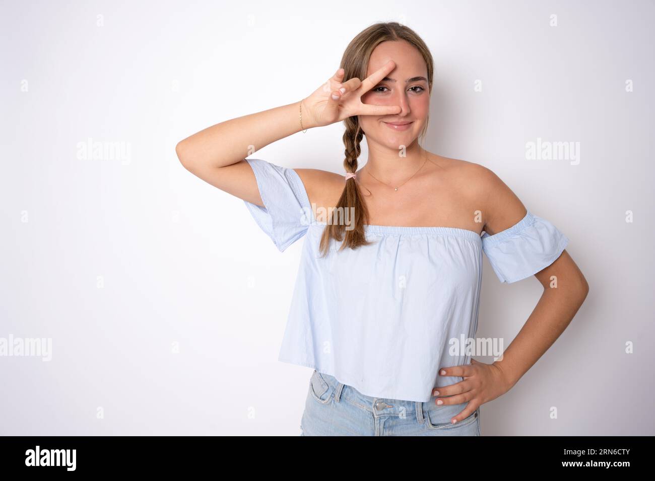 Portrait of cute sweet gorgeous she give v-sign near eye make hollywood white smile stand ...