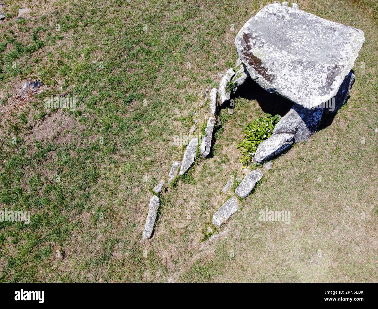 Aerial view of a dolmen, a prehistoric tomb. Anta da Barrosa, Praia de ...