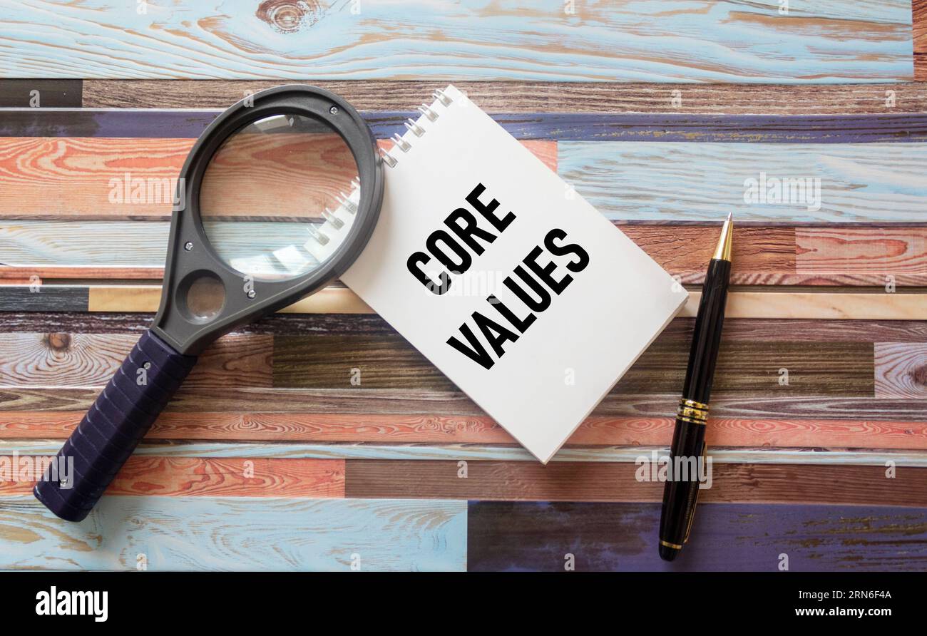 On a notebook the word CORE VALUES on a vintage background with a ...