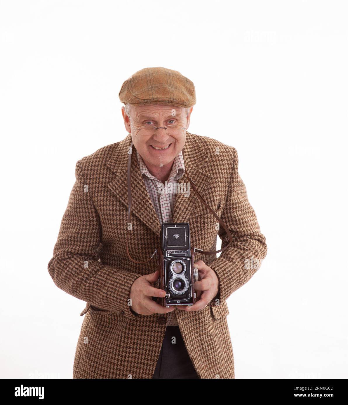 A mature Englishman photographer in classic tweeds Stock Photo - Alamy