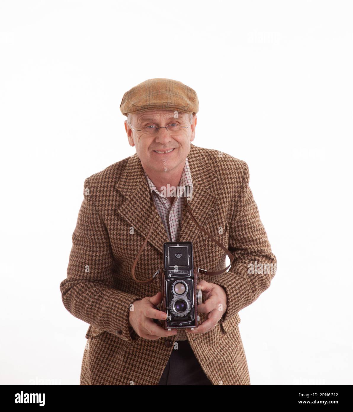 A mature Englishman photographer in classic tweeds Stock Photo - Alamy