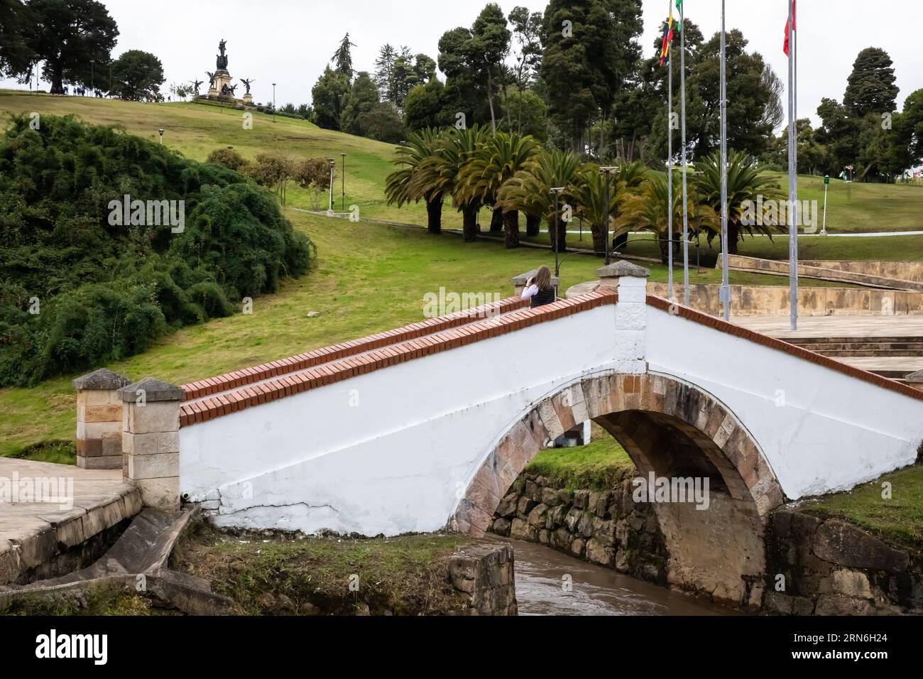 Female tourist taking pictures at the famous historic Bridge of Boyaca ...