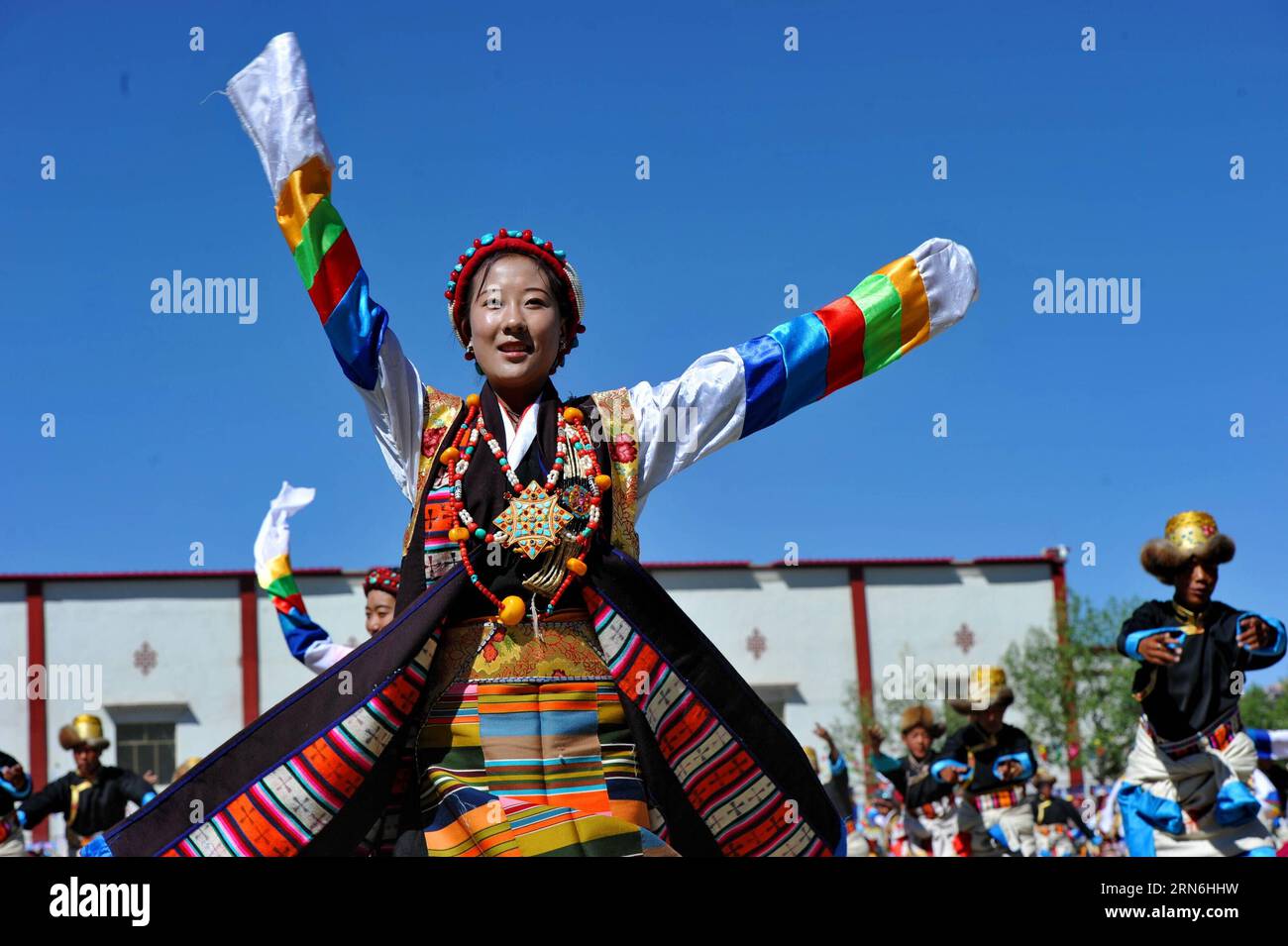 People dance on the ceremony of Dama Festival in Jiangzi, southwest ...