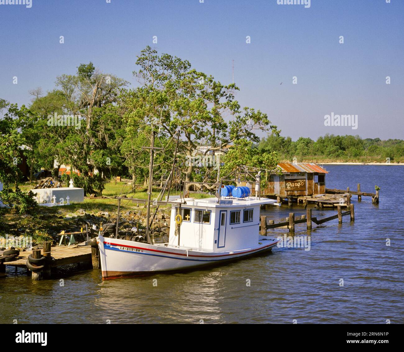 1980s FISHING BOAT AT DOCK IN SMALL TOWN IN MISSISSIPPI DELTA REGION ...